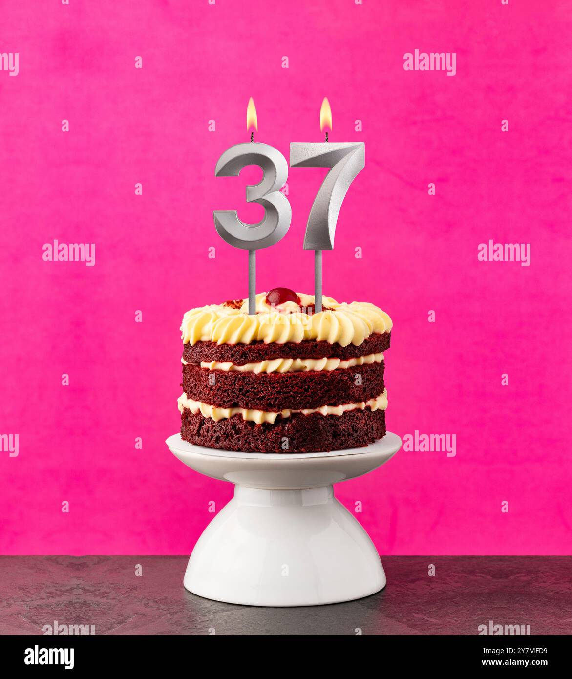 Birthday cake with number 37 candle - Red velvet on a fuchsia ...