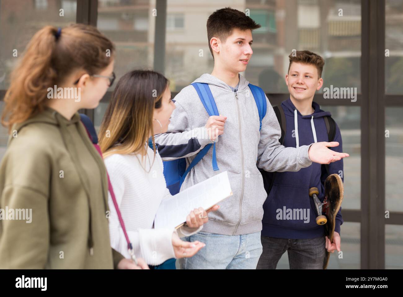 Teenage students talking outside after lessons Stock Photo - Alamy