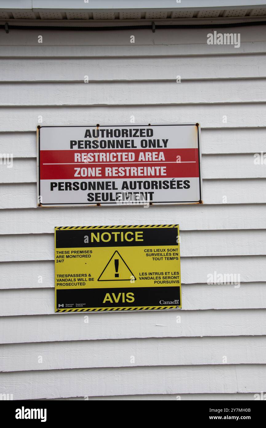 Restricted area and premises monitored signs at Fort Amherst in St ...