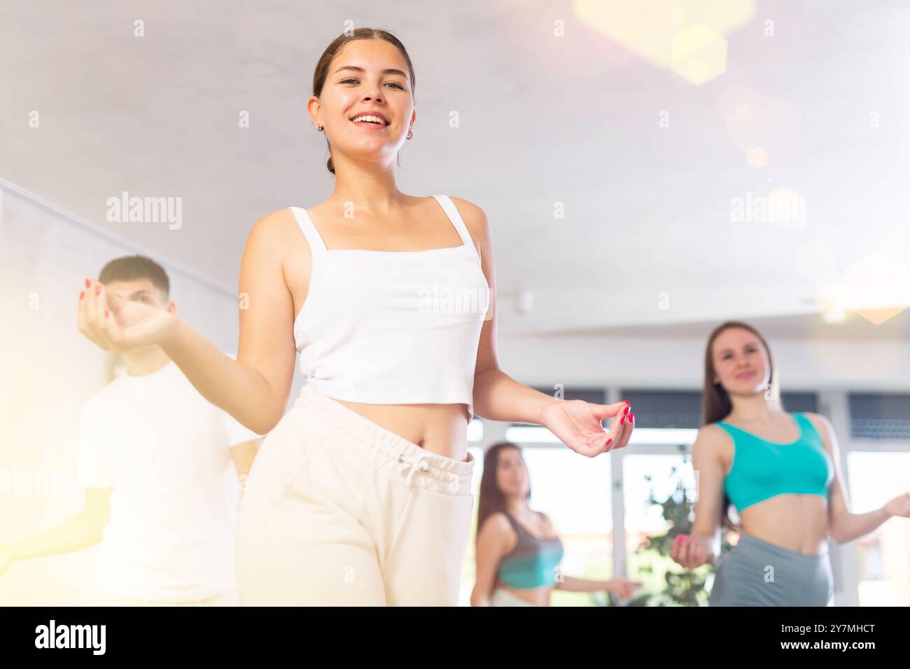 Girl teen perform choreographic exercise and teach energetic mobile ...