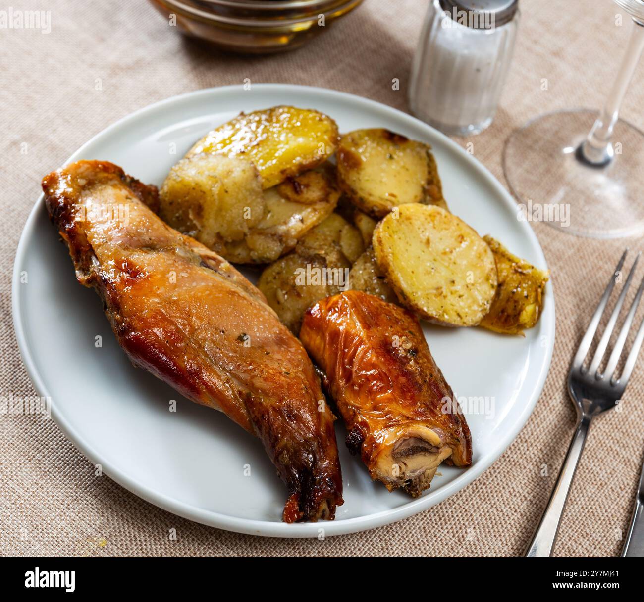 Baked rabbit with potatoes Stock Photo - Alamy