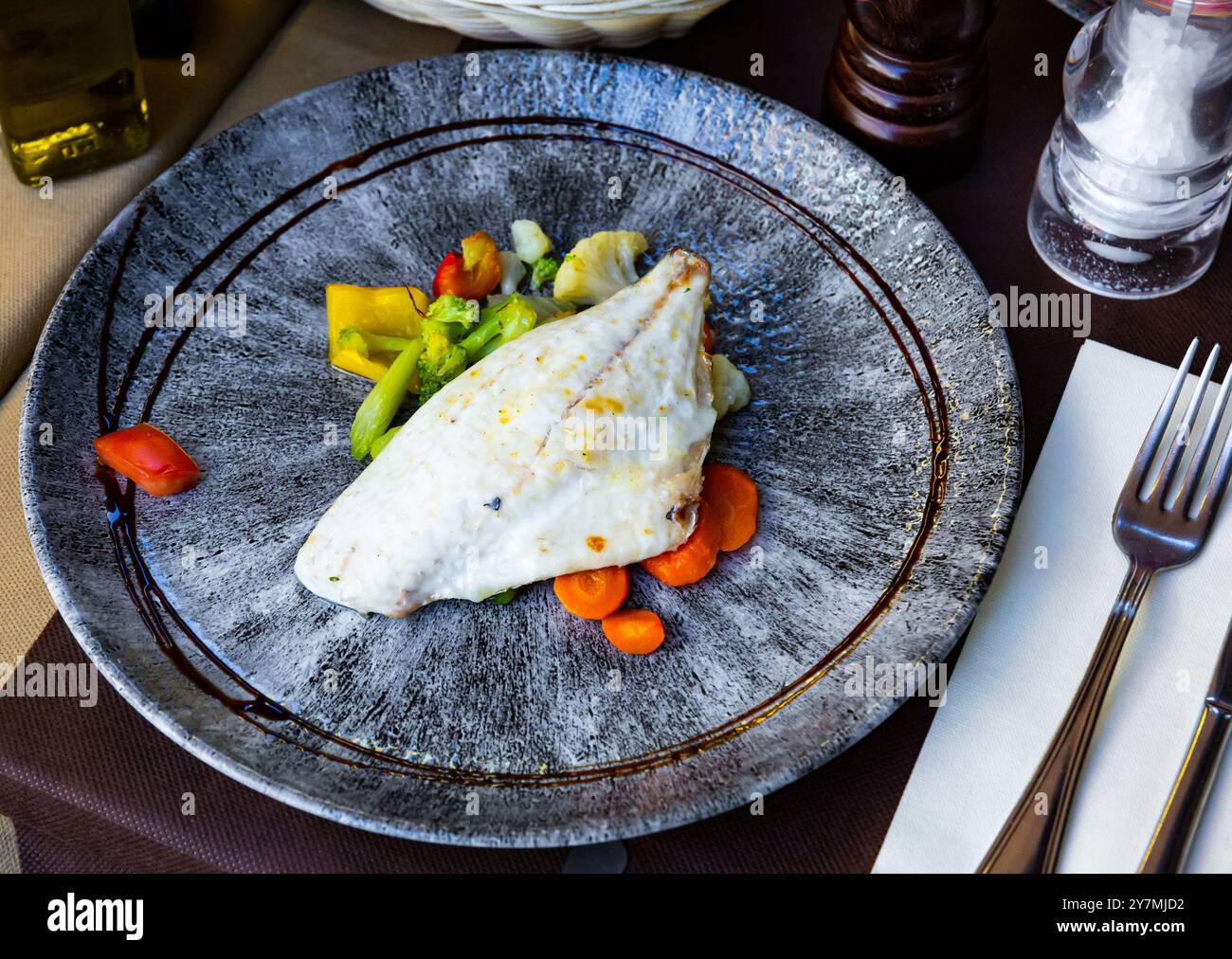 Baked dorado fish fillet with broccoli, carrot and pepper Stock Photo ...