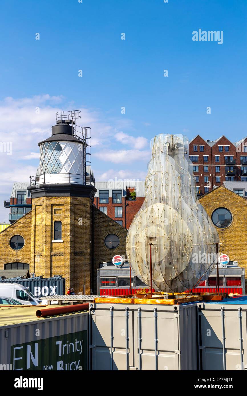 'Light Bulb' sculpture by Claire Morgan and the Bow Creek Lighthouse in Trinity Buoy Wharf, East ...