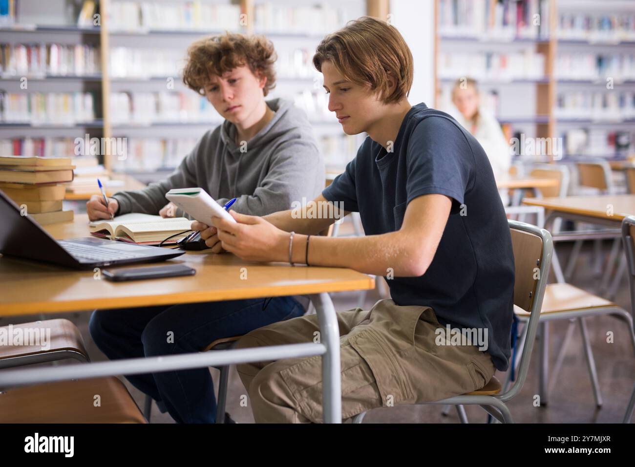 Teenage boys in library Stock Photo - Alamy