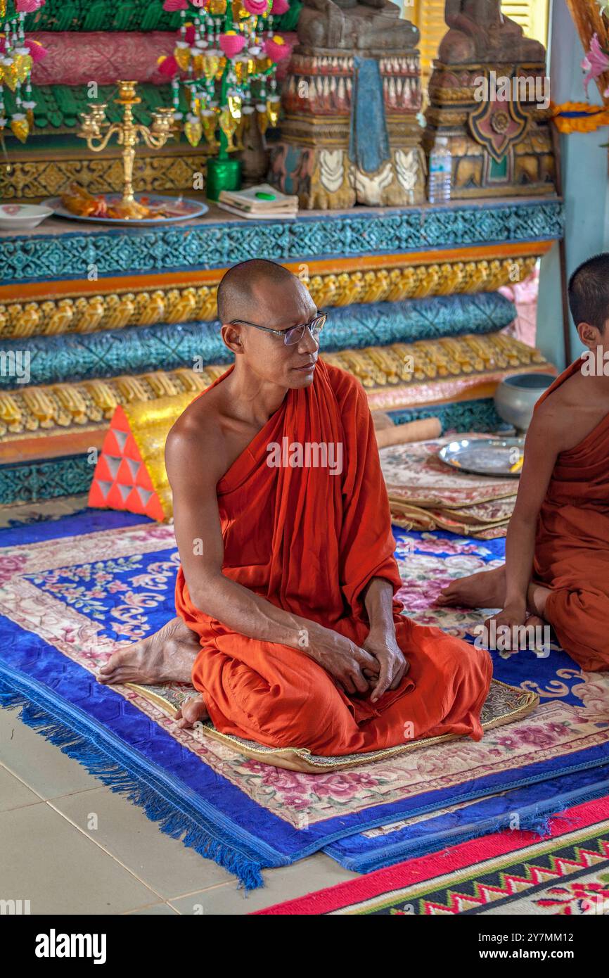 Buddhist monks performing a blessing ceremony and tying strings on the ...