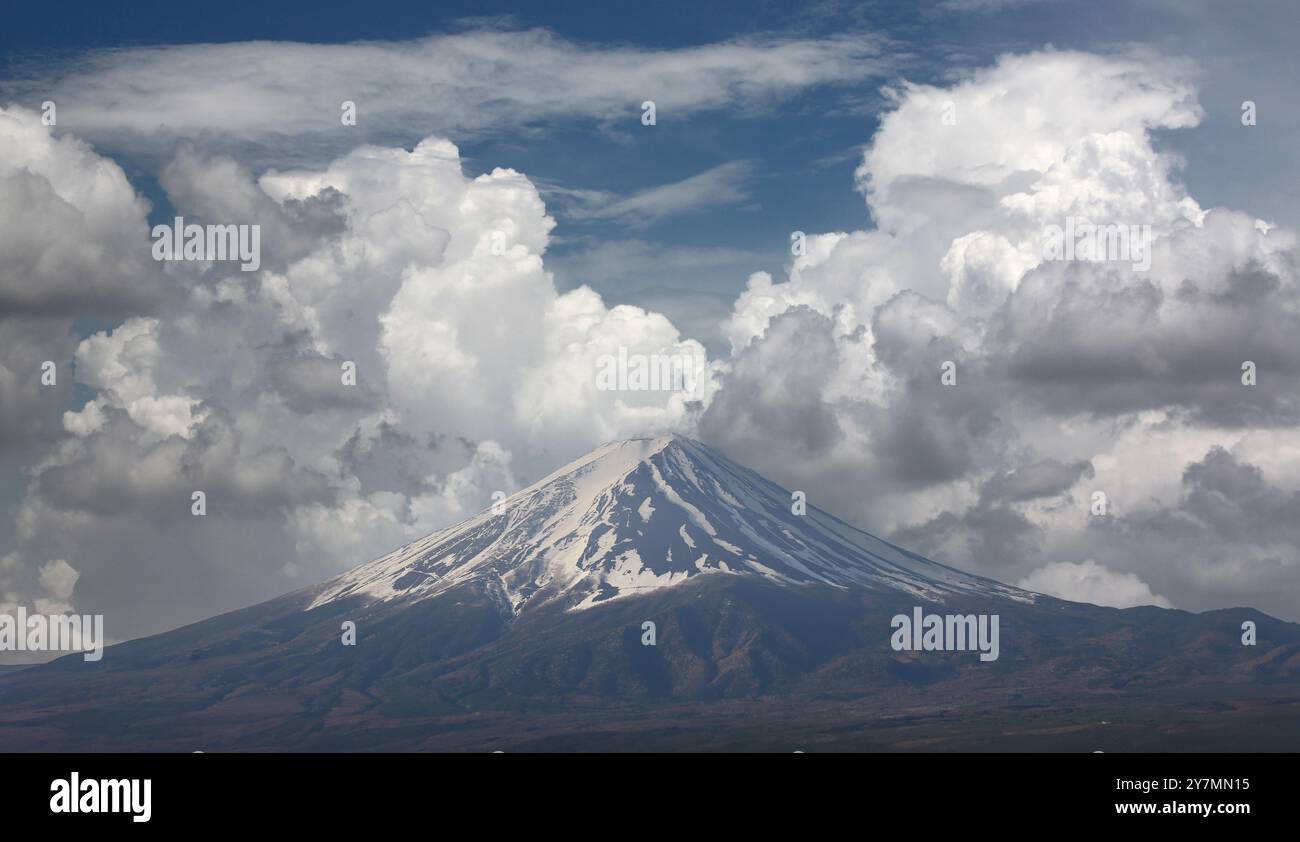 Mount Fuji in the daytime with white clouds as a background.View of ...