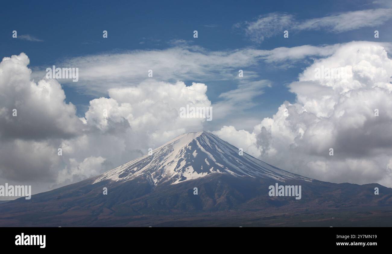 Mount Fuji in the daytime with white clouds as a background.View of ...