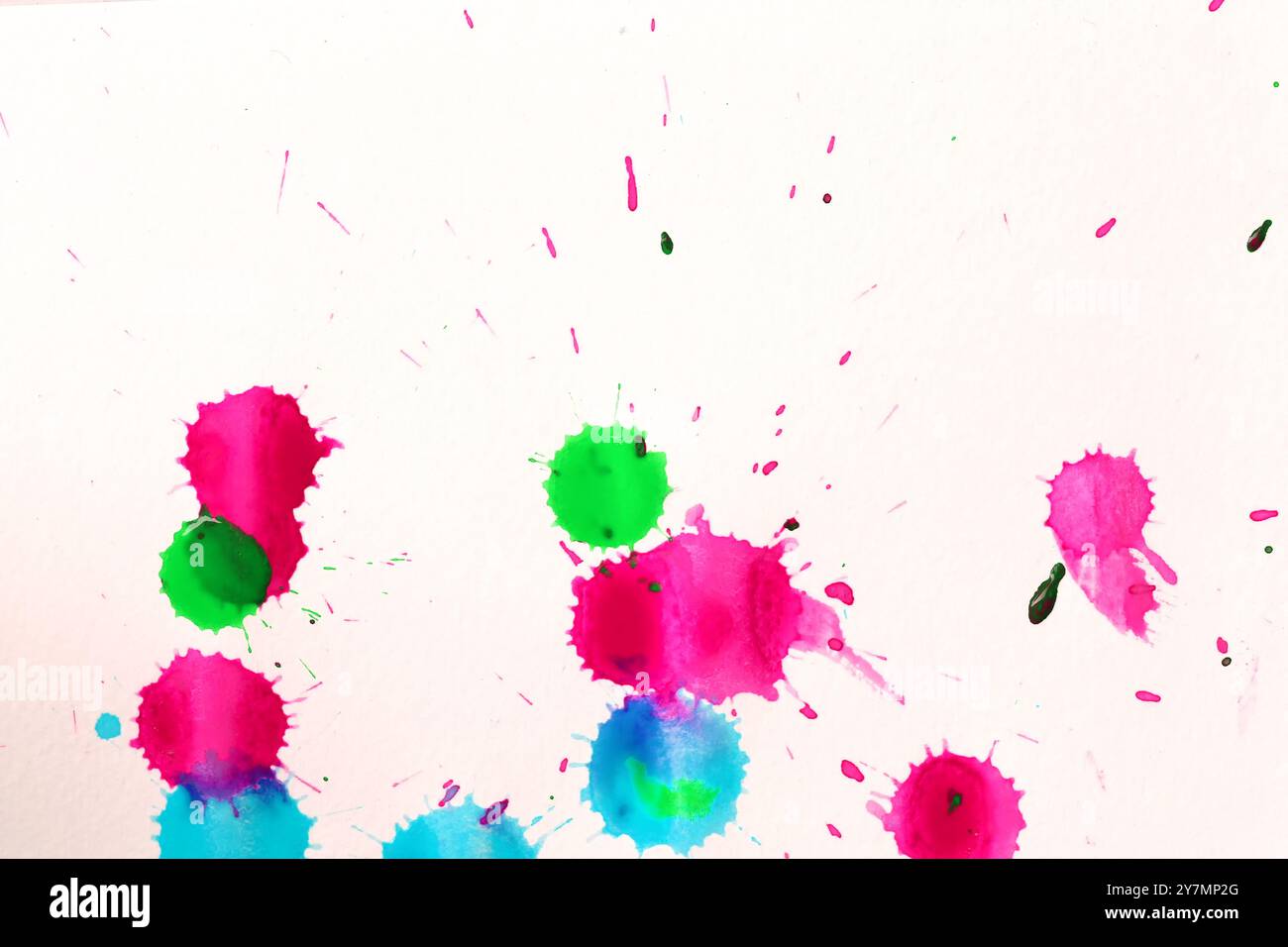 Various color paint drops on paper, causing dispersion of color, use it ...