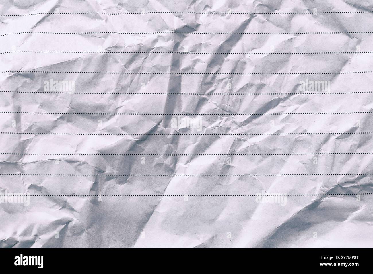 A detailed close-up of crumpled paper featuring lined patterns, ideal ...