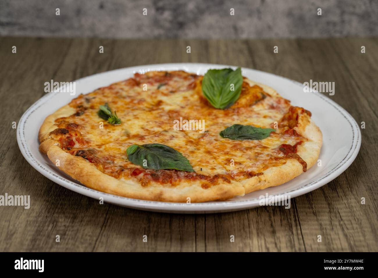 Margherita pizza cooked to perfection with extra crispy crust Stock ...