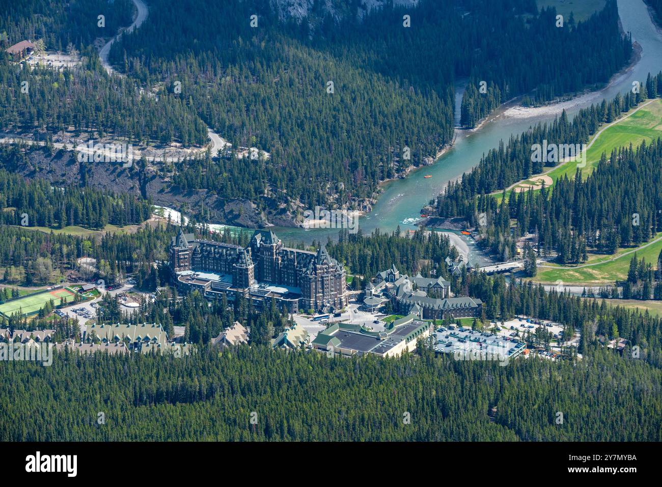 View of the stunning Fairmont Banff Springs Hotel in the town during spring time with incredible ...