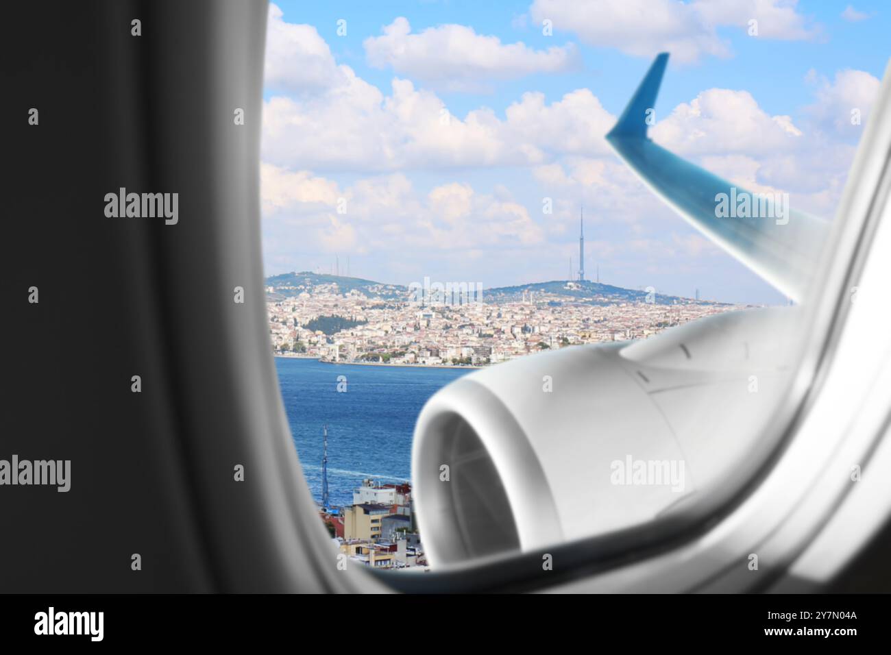 Airplane taking off or landing, view on city from window Stock Photo ...
