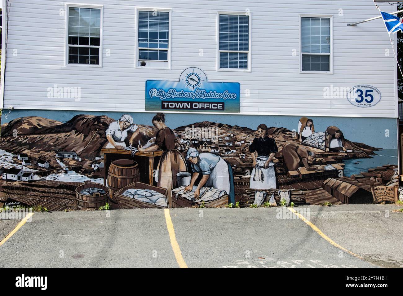 Mural of women drying cod on the beach on the town office on NL 11 in ...