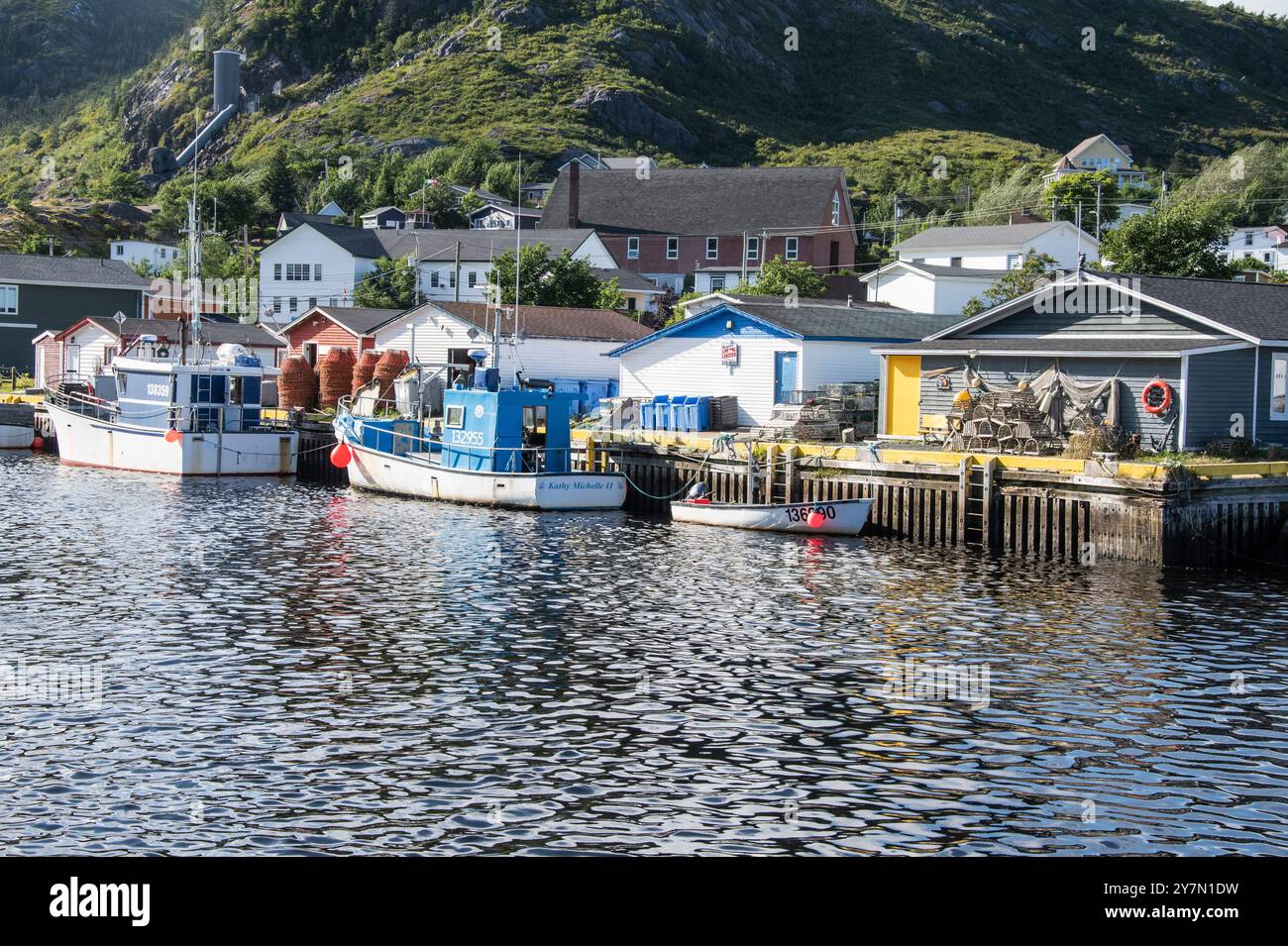 Fishing boats tied up at the dock in Petty Harbour–Maddox Cove ...