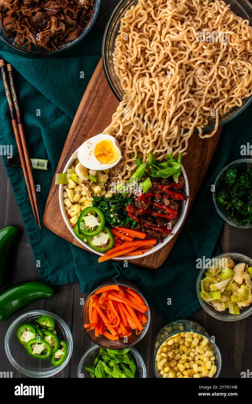 Ramen Noodles Spilling into a Bowl of Pork and Vegetable Ramen: Ramen ...