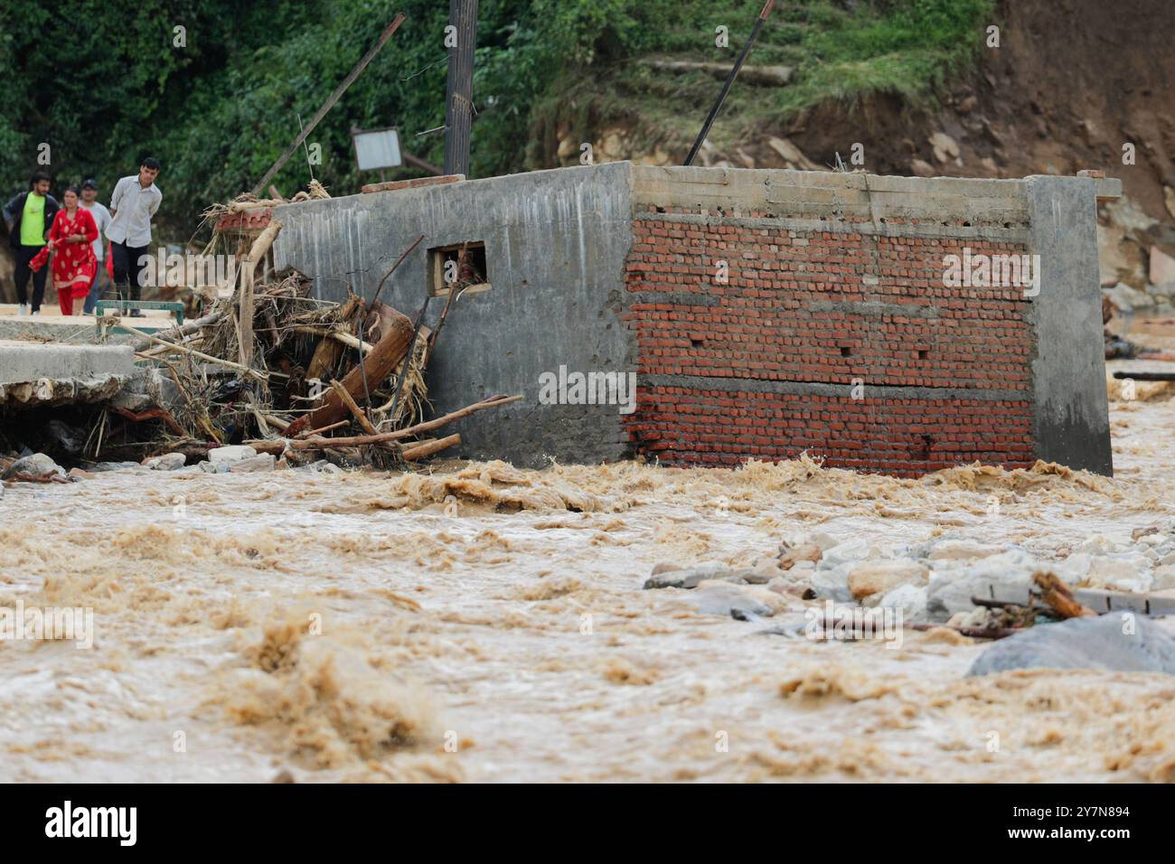 Panauti, Nepal. 30th Sep, 2024. A house is submerged in the Roshi River ...