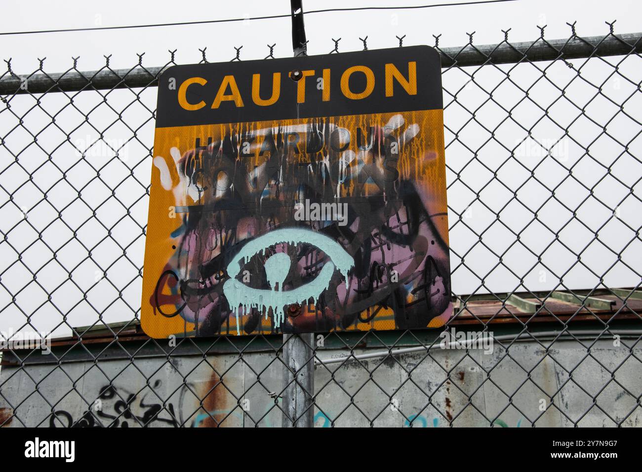 Caution sign at abandoned dilapidated Central Swine Breeding Station in ...