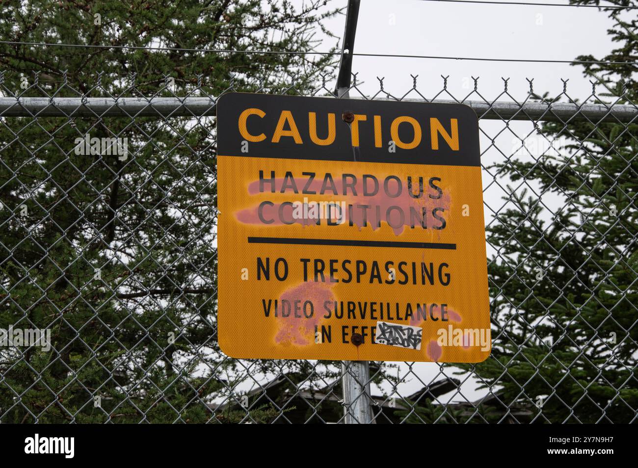 Caution sign at abandoned dilapidated Central Swine Breeding Station in ...