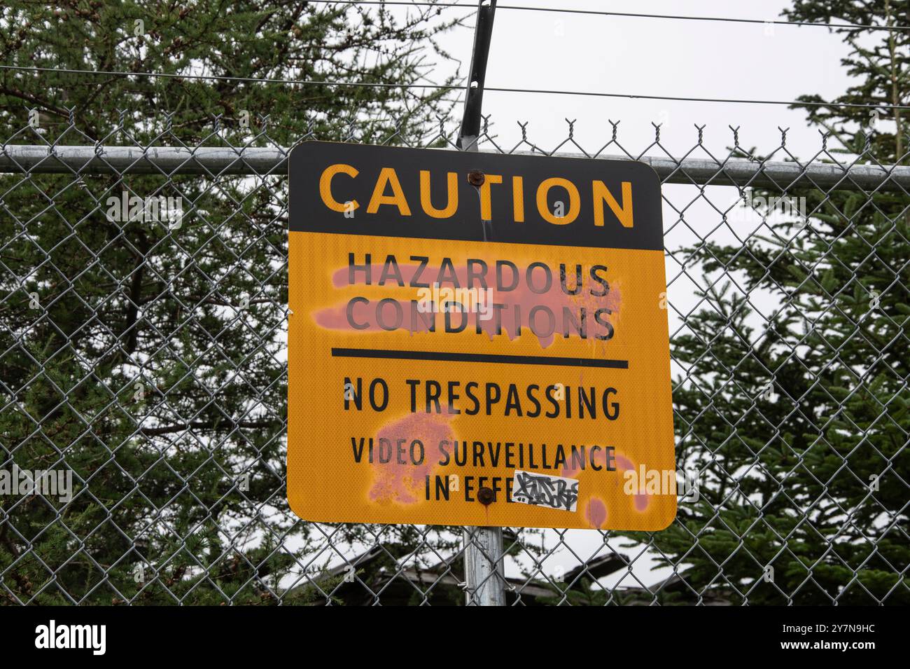 Caution sign at abandoned dilapidated Central Swine Breeding Station in ...
