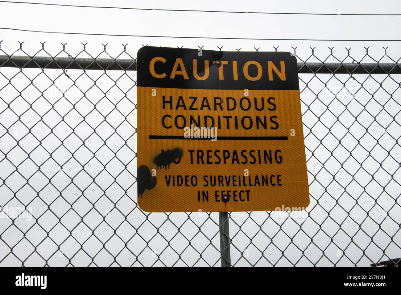 Caution sign at abandoned dilapidated Central Swine Breeding Station in ...
