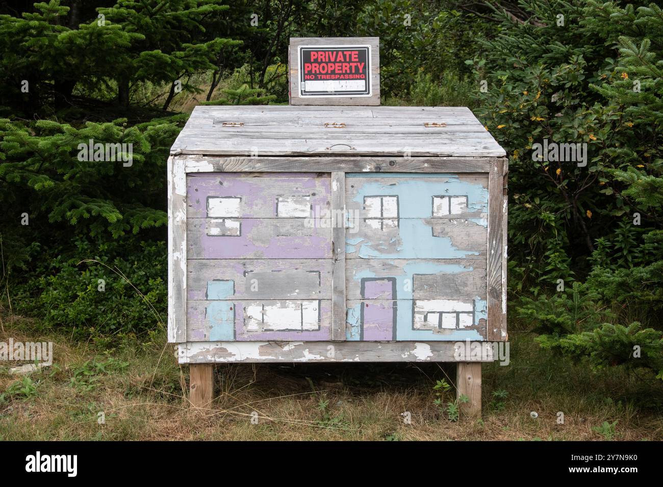 Colorful jellybean row garbage bin and private property sign on Powers ...
