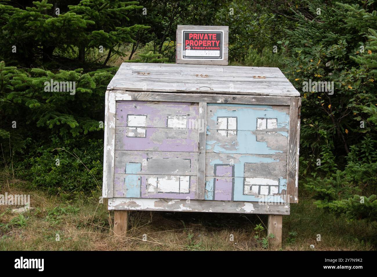 Colorful jellybean row garbage bin and private property sign on Powers ...