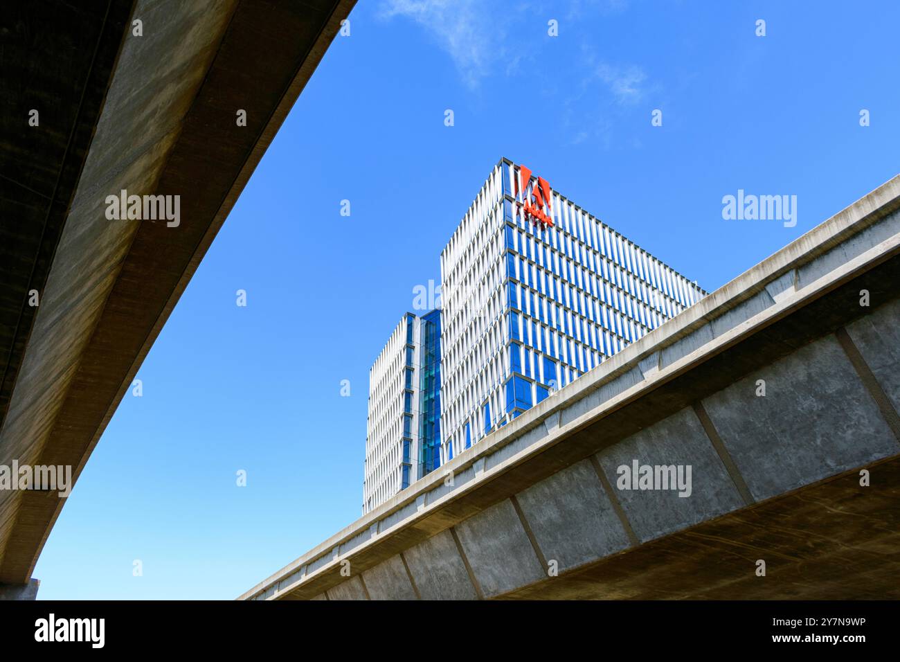 Modern Adobe Founders Tower headquarters building framed by highway ...