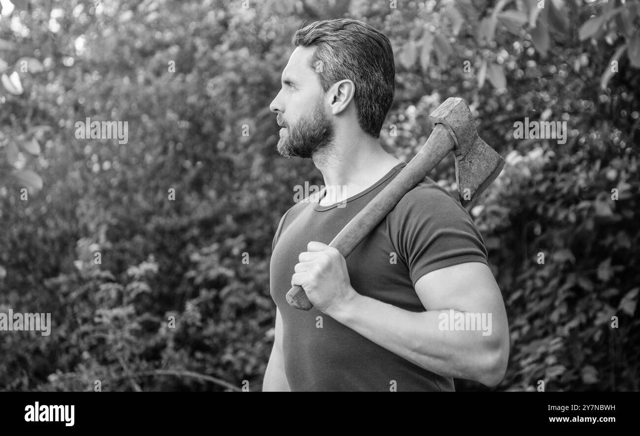 man hold axe wearing shirt. man with axe outdoor. photo of man with axe ...