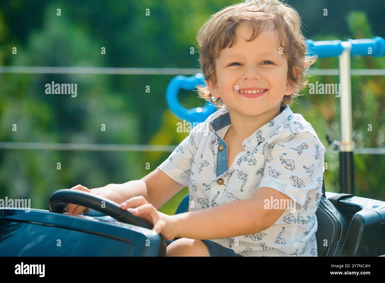 Kid Driver. Cute little baby boy pretending to drive. Kid in car with ...