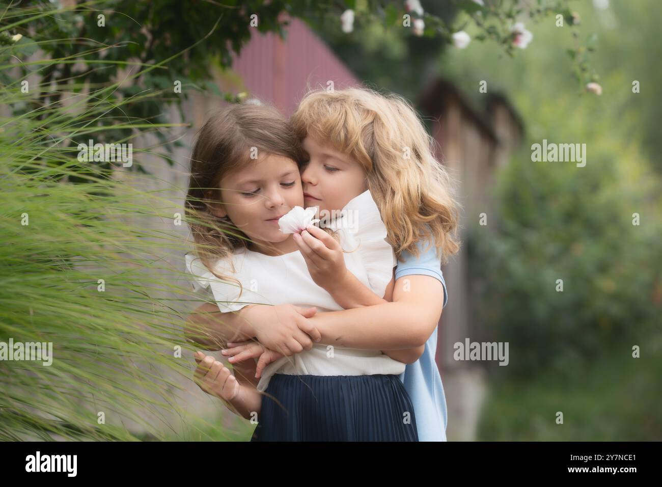 Little boy hugging shy girl, toddler boy embracing depressed little ...