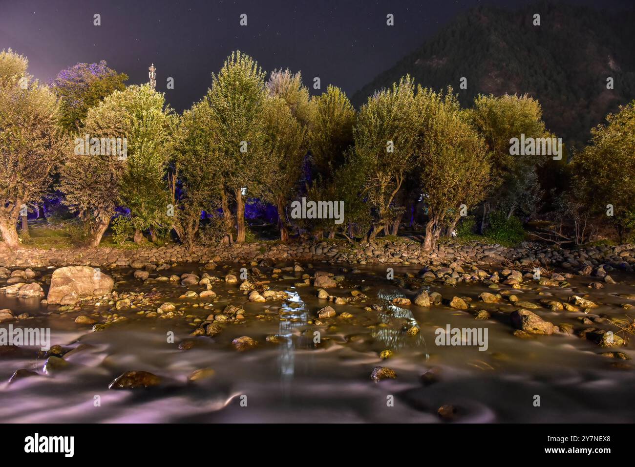 Pahalgam, India. 30th Sep, 2024. A long exposure photo shows a stream ...