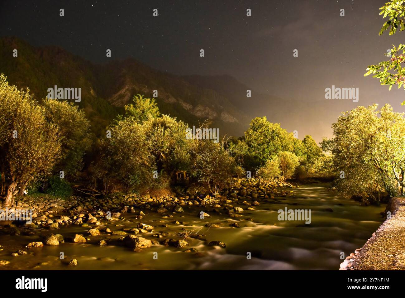 Pahalgam, India. 30th Sep, 2024. A long exposure photo shows a stream ...