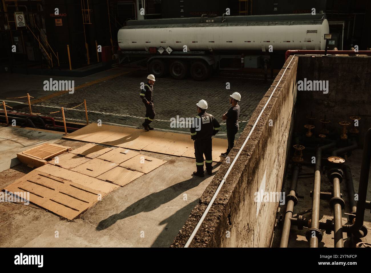 The shipyard construction workers wearing safety helmets and standing ...