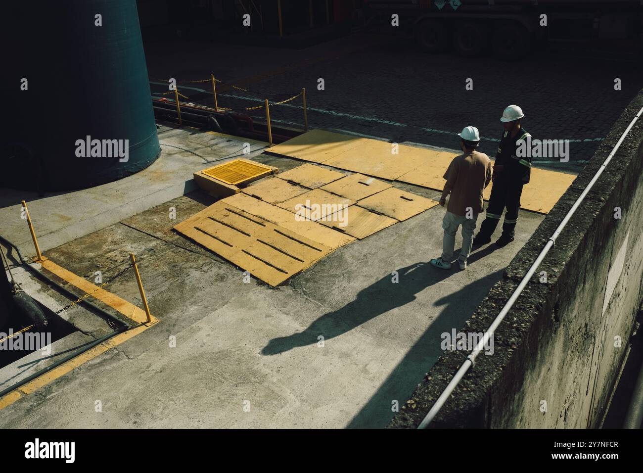 The shipyard construction workers wearing safety helmets and standing ...