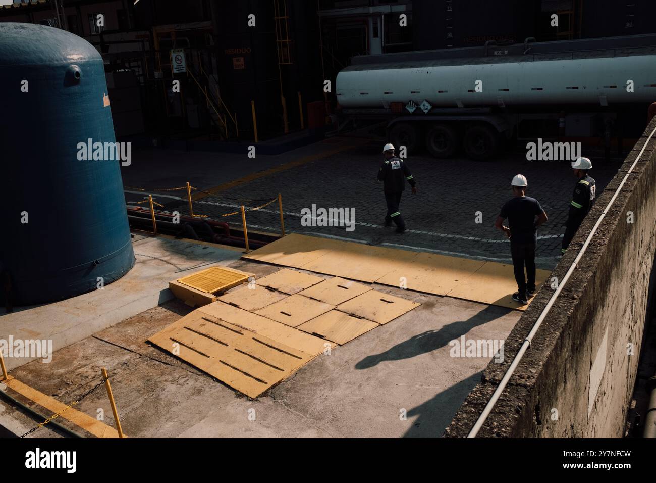 The shipyard construction workers wearing safety helmets and standing ...