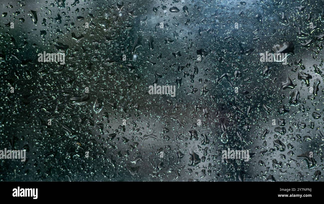 Rain drops on window glass , Wet window with rainy drops , Blurry ...