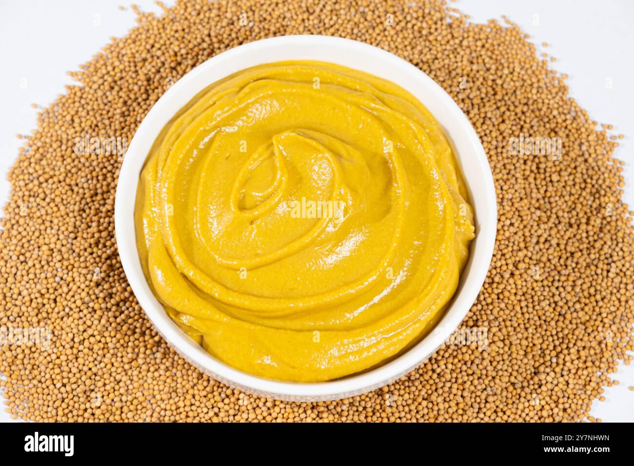 Mustard sauce and dry mustard seeds, top view Stock Photo - Alamy