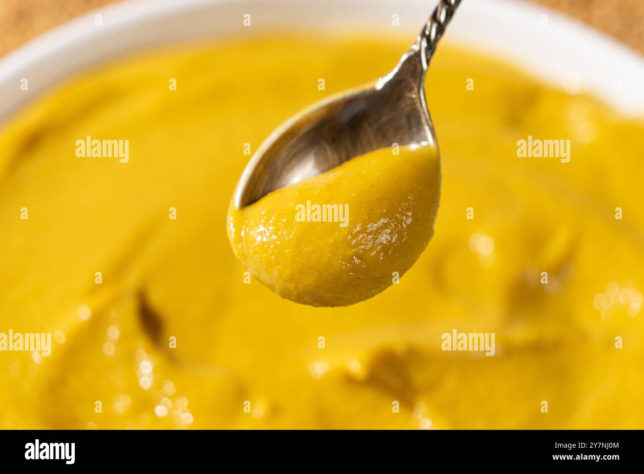 Traditional spicy mustard sauce in a spoon close-up Stock Photo - Alamy