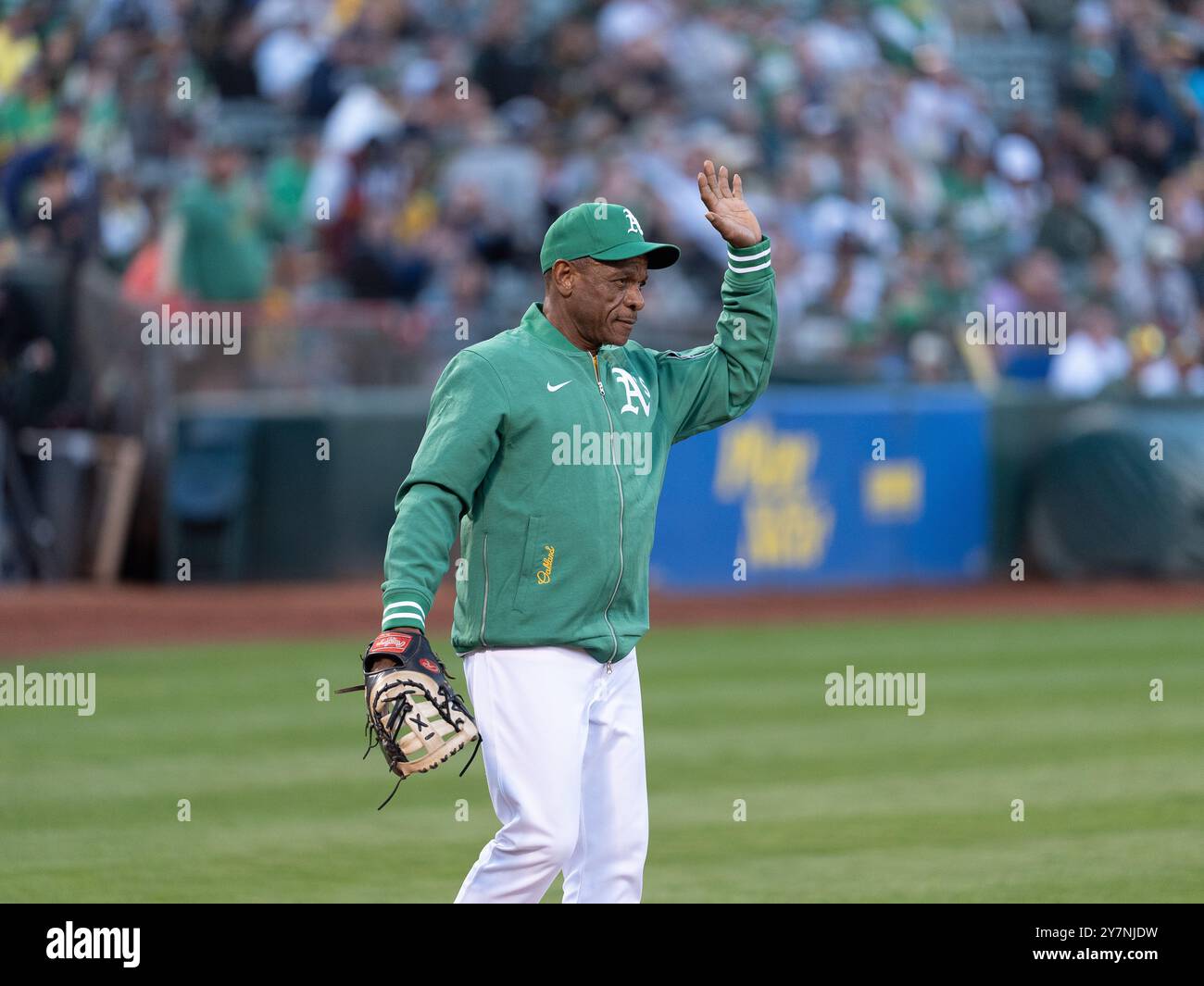 Former Oakland Athletics player Ricky Henderson (24) waves to the crowd ...
