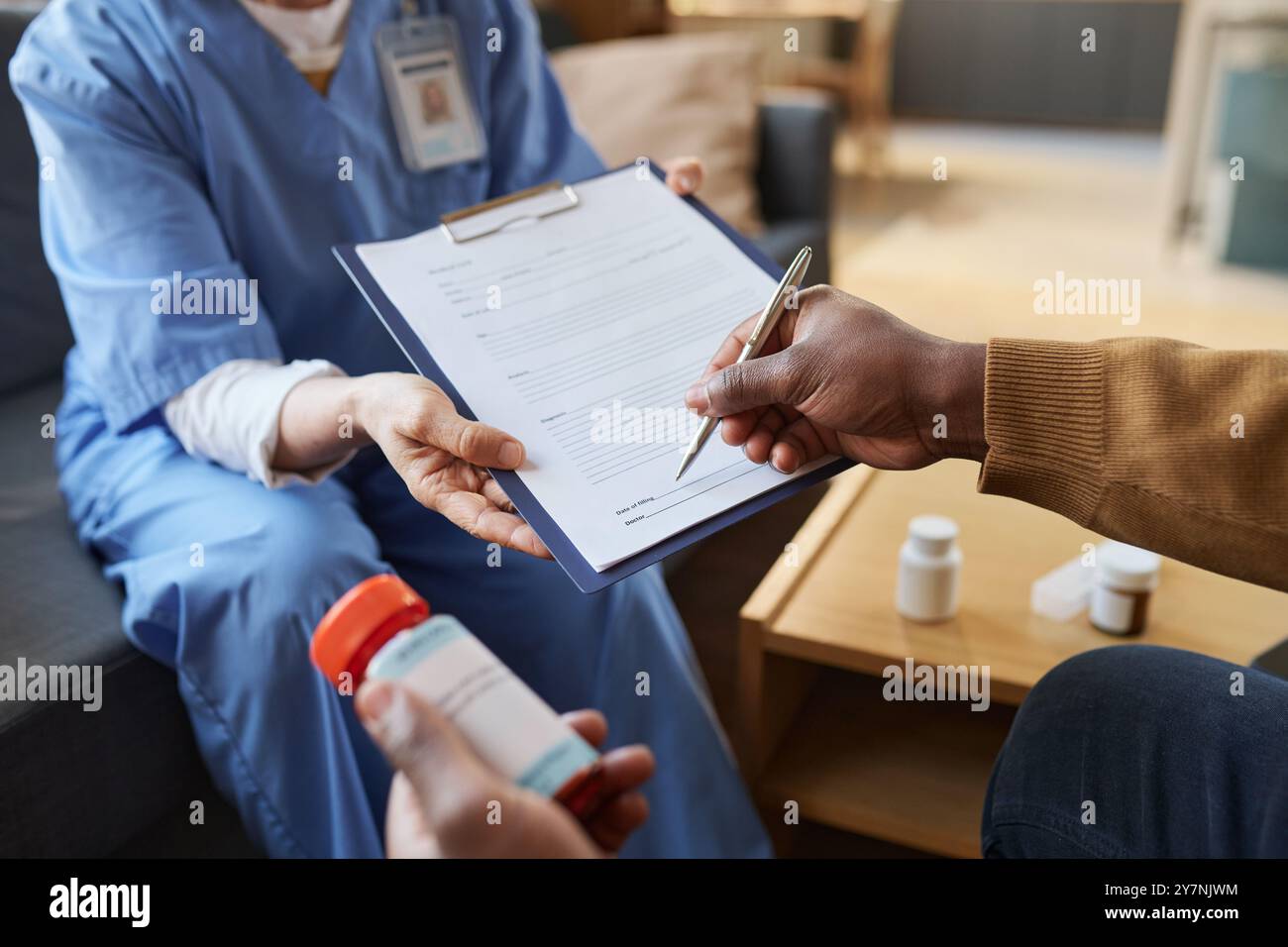 Black Man Signing Medical Form on Clipboard Stock Photo - Alamy