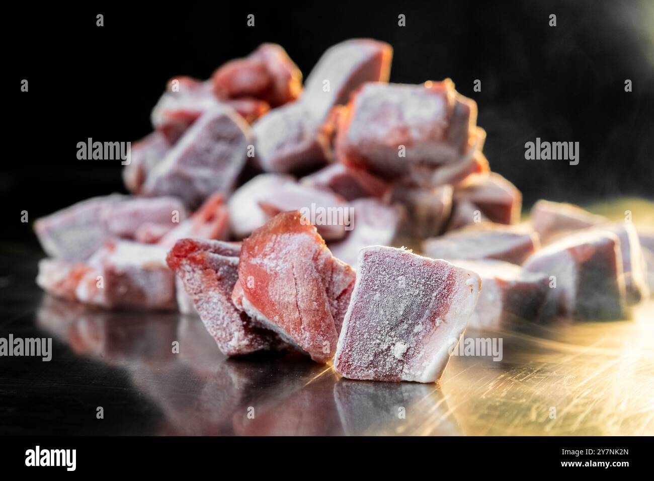 pile of frozen meat cube on a stainless steel table Stock Photo - Alamy