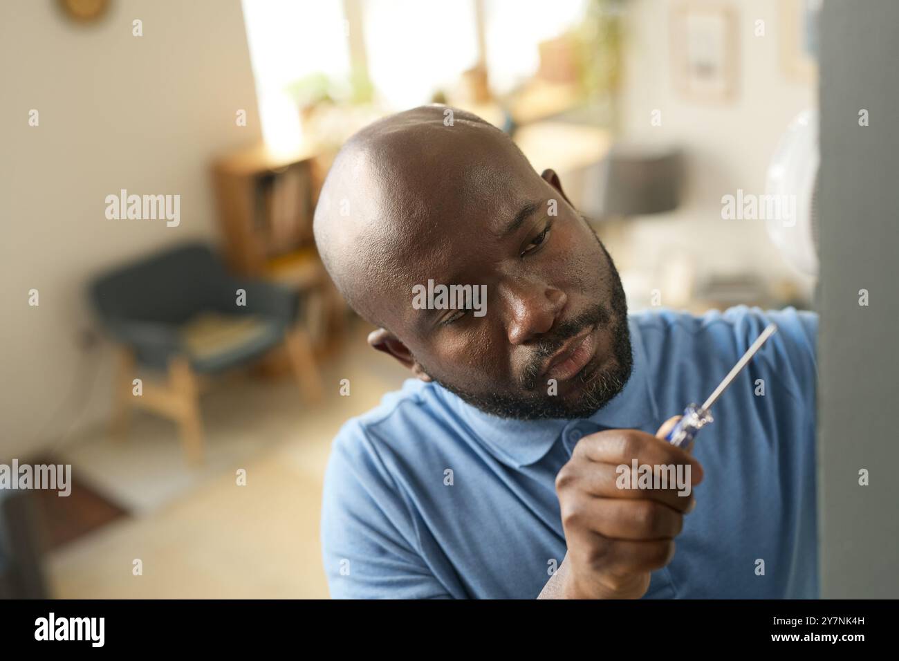 Black Man Mounting Home Surveillance Camera Stock Photo - Alamy