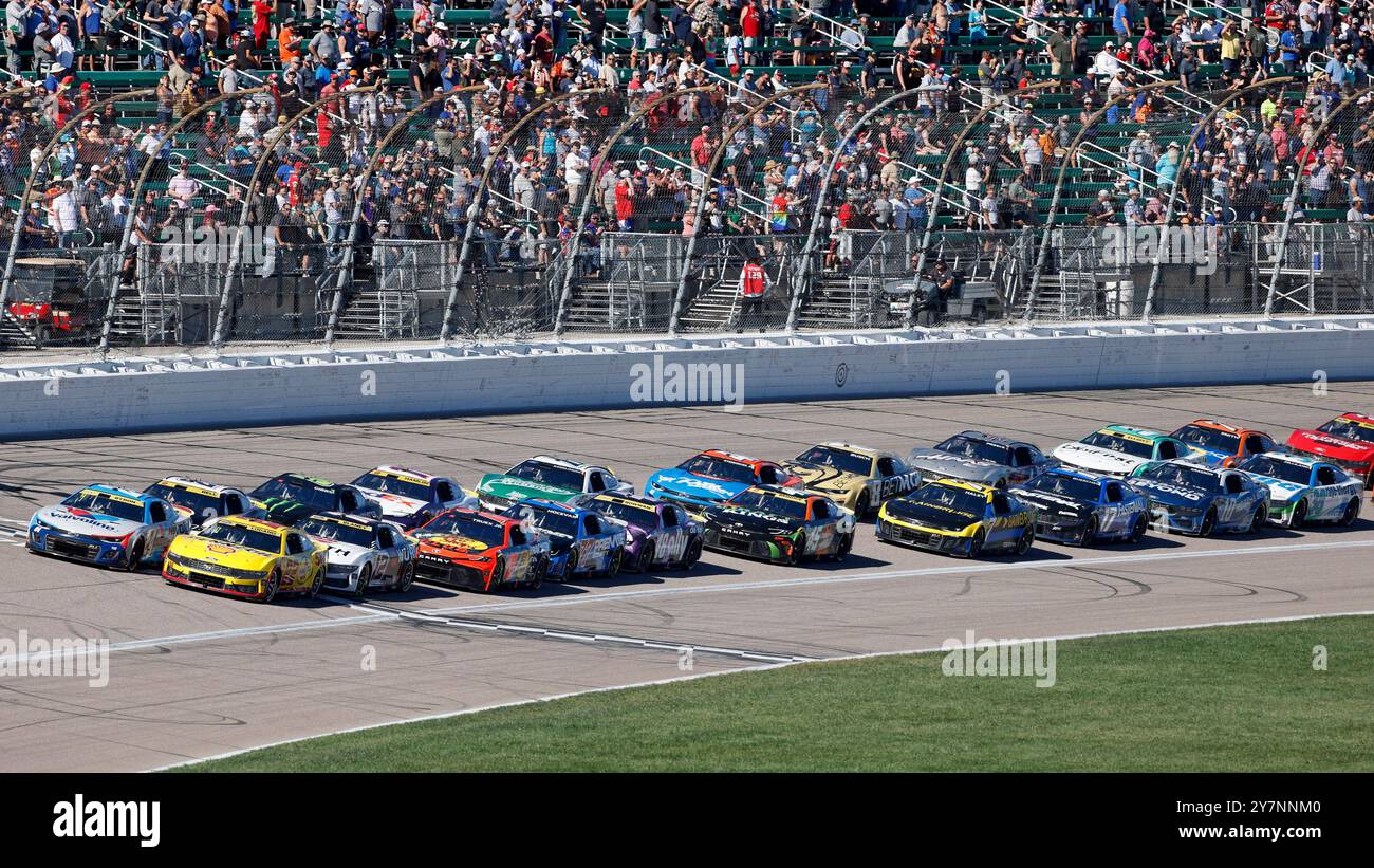 Drivers cross the start/finish line during a restart at a NASCAR Cup ...
