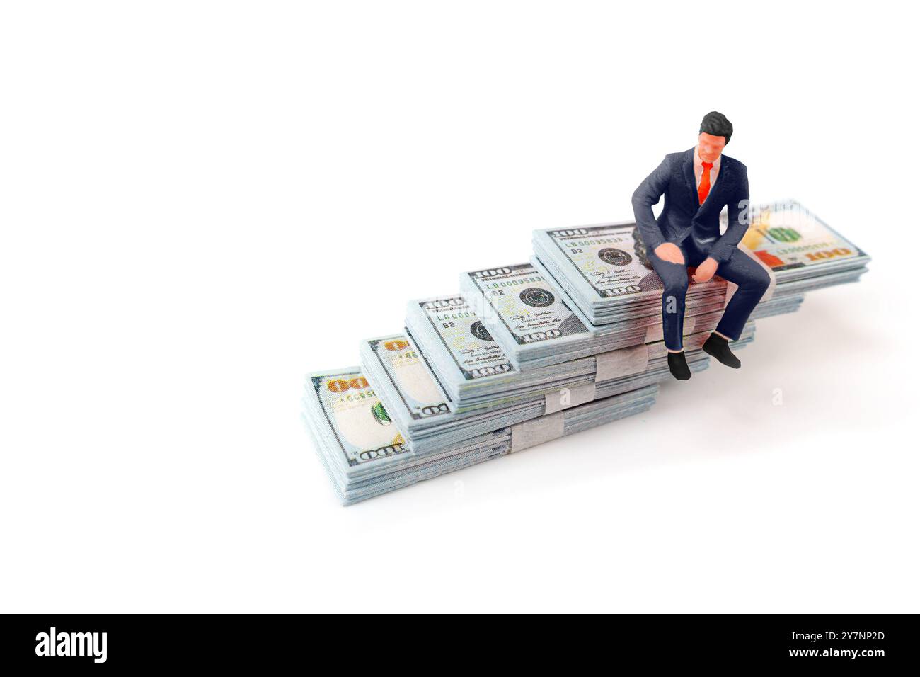 Miniature businessman figure seated hi-res stock photography and images ...