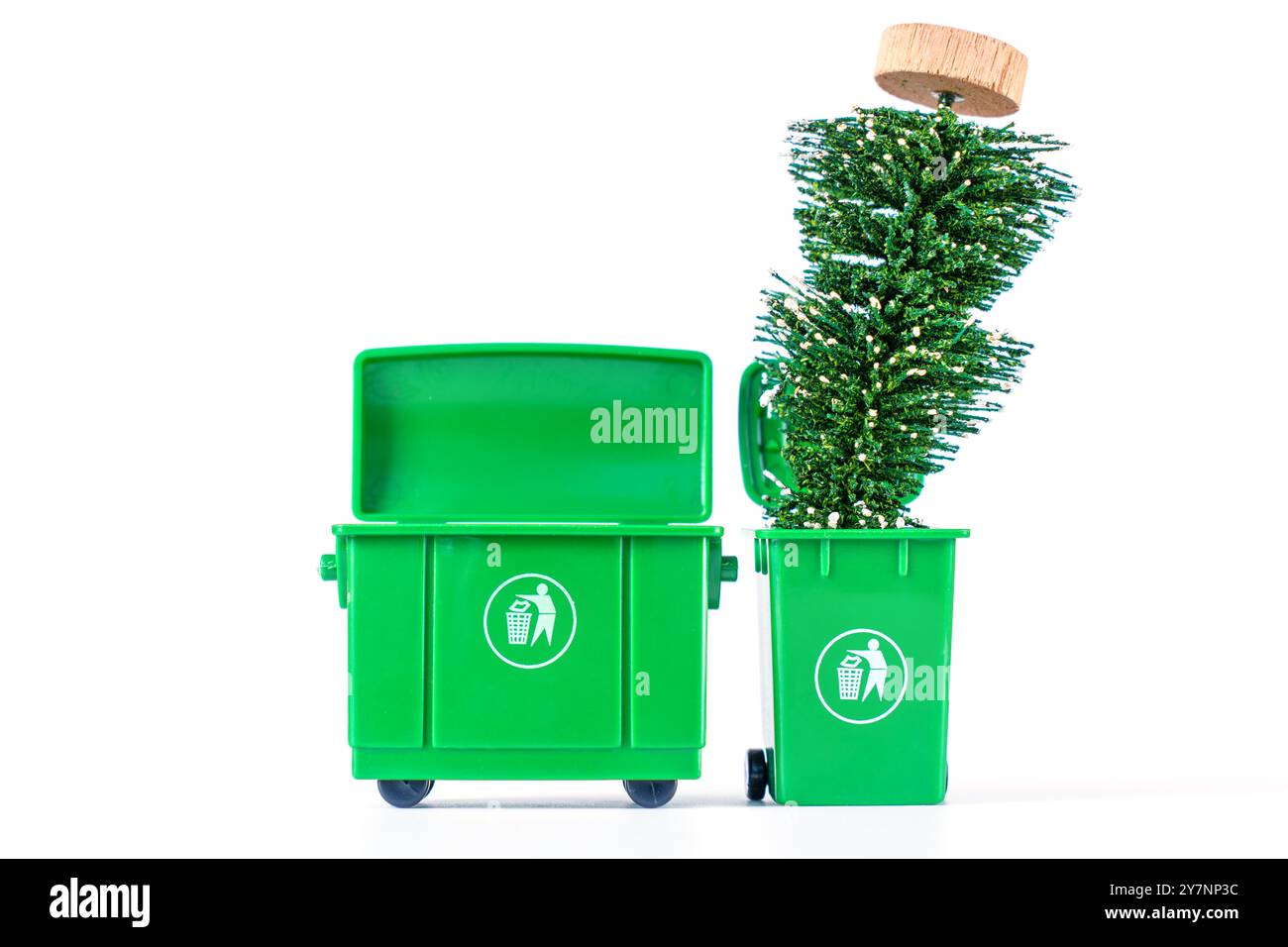 Green trash bins featuring an artificial Christmas tree for sustainable ...