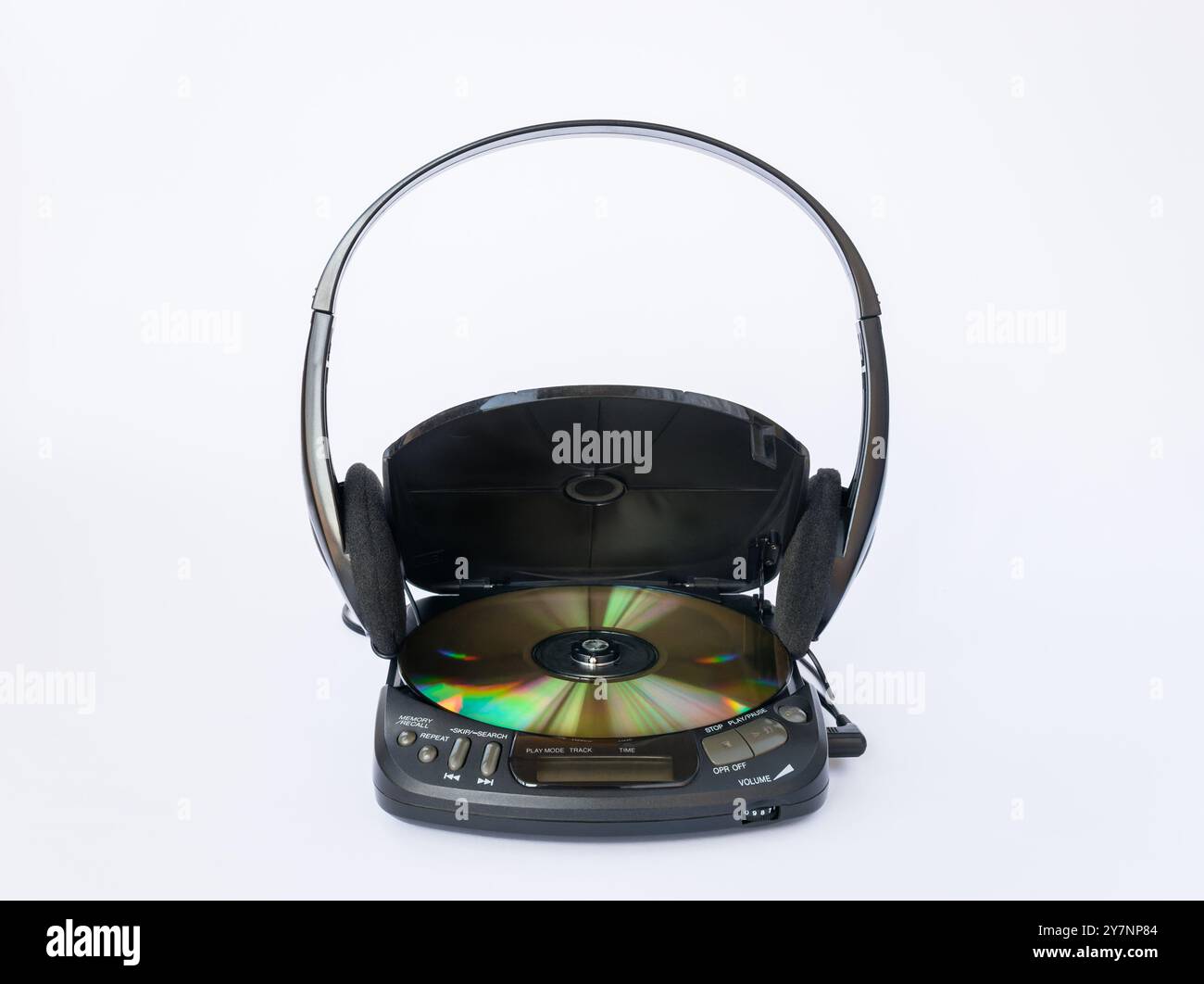 Close-up view of CD player with open lid and golden CD inside and ...