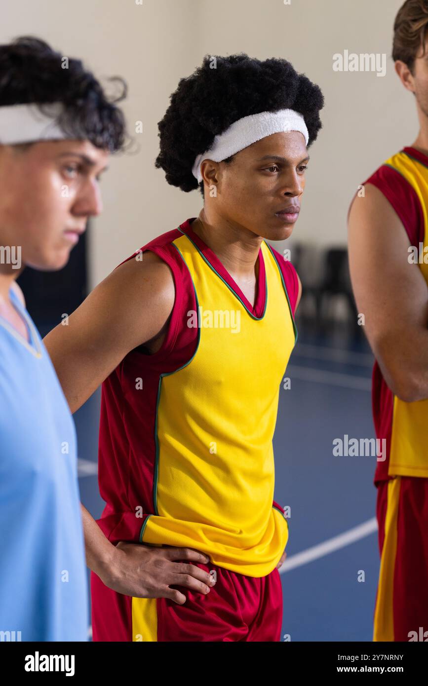 Diverse Basketball players in gym wearing uniforms and headbands ...