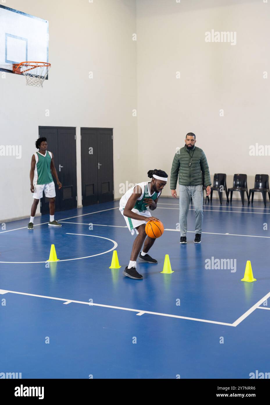 Basketball player practicing dribbling skills hi-res stock photography ...