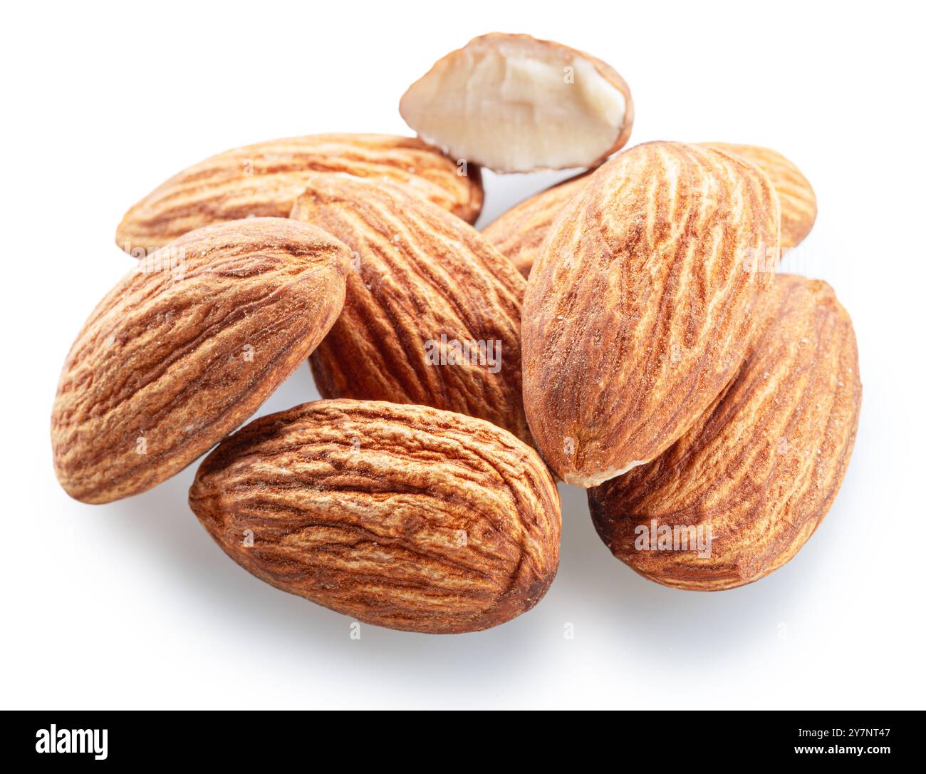 Pile of shelled almond nuts isolated on white background. File contains ...