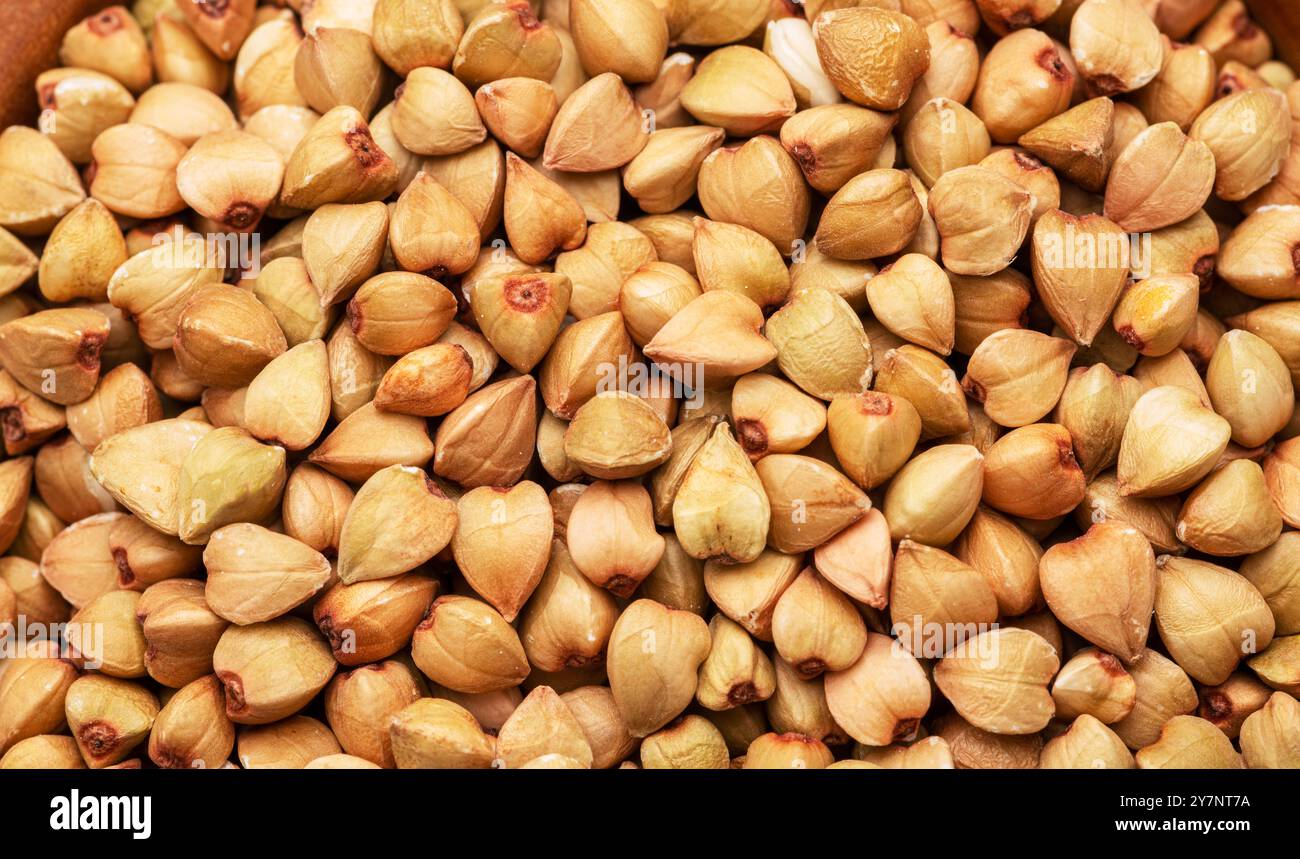 Hulled kernels of buckwheat grains close up. Food background Stock ...